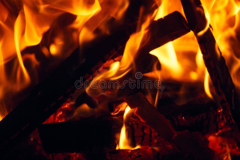 A Fire Burns in a Fireplace, Fire To Keep Warm. Logs Burning in a ...