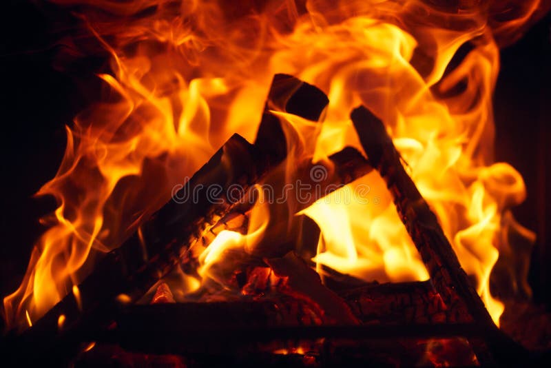 A Fire Burns in a Fireplace, Fire To Keep Warm. Logs Burning in a ...