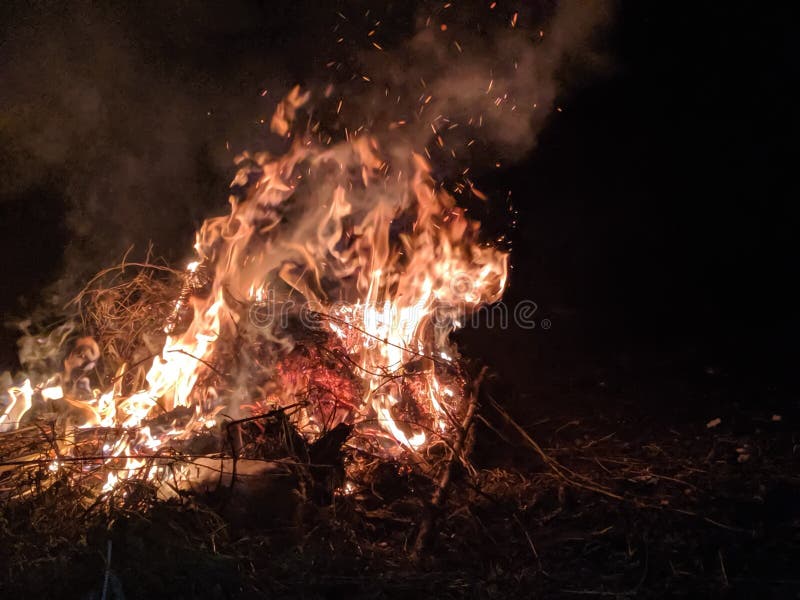 Fire burns at night stock photo. Image of campfire, person - 233909518