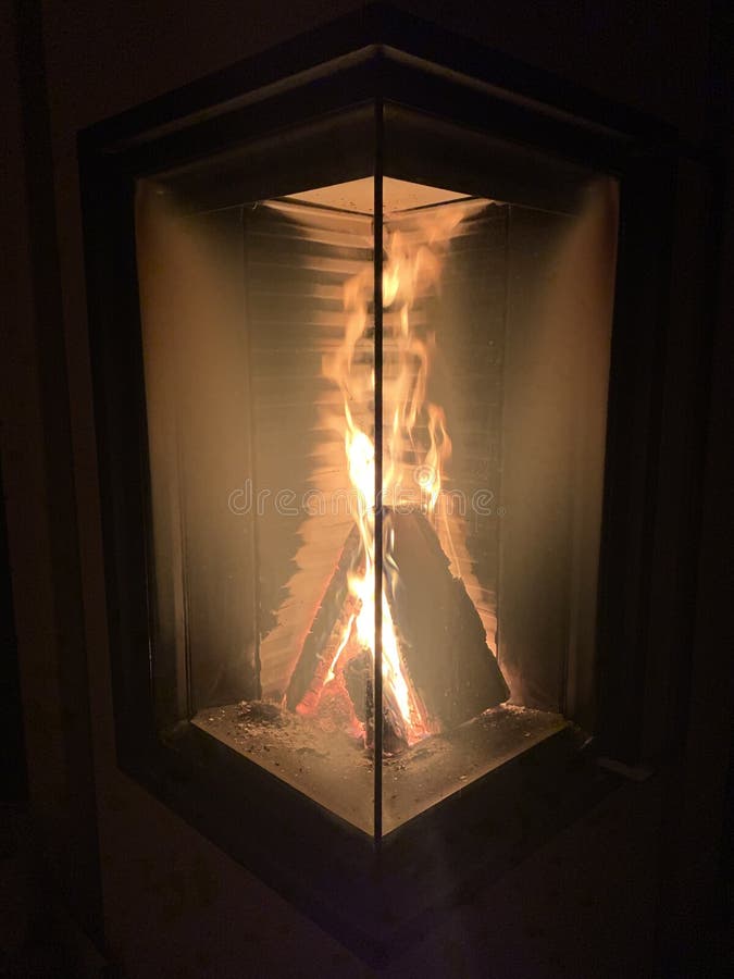 A Fire Burns in a Vertical Fireplace Stock Photo - Image of fireplace ...