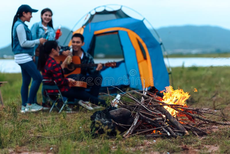 Fire at Camp and Group of Friends Drinking Beer Together. Camp and ...