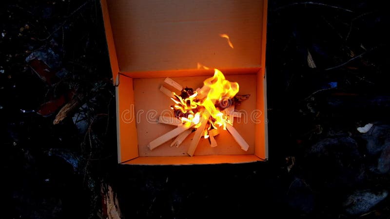 Fire in the cardboard box stock video. Video of plink - 219441395