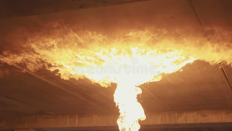 Fire on the Ceiling from Flamethrower at Dark in Slow Motion. Stock ...
