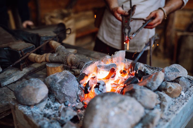 Fire Crackling in Blacksmith Workshop of Forging Metal. Anonymouse ...