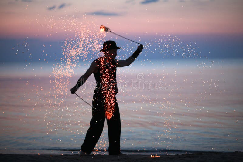 Fire Dancer Silhouette on Sunset Sky Background Stock Image - Image of ...