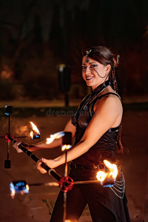 Fire Dancer Performing with Flaming Staff at Night Stock Image - Image ...