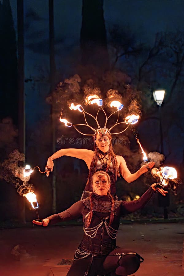 Fire Dancers Performing with Flames at Night in a Park Stock Photo ...