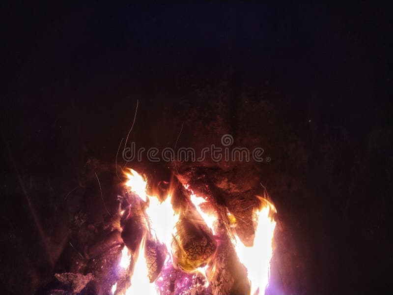 Fire in the dark of night stock photo. Image of dark - 167919408