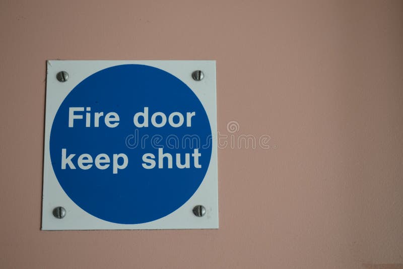 Fire door sign stock image. Image of health, round, blue - 52480423