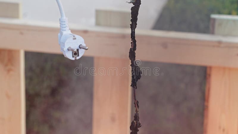 Fire on an Electric Wire with a Plug in the Hands of a Man. Stock Video ...
