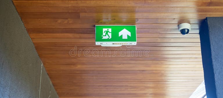 Fire Emergency Exit Sign on the Wall Background Inside Building. Safety ...