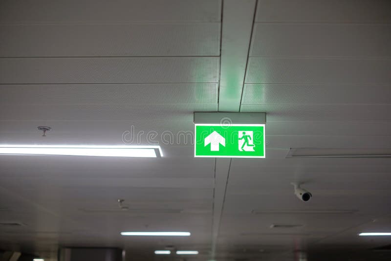 Fire Emergency Exit Sign on the Wall Inside Building at Subway Train ...