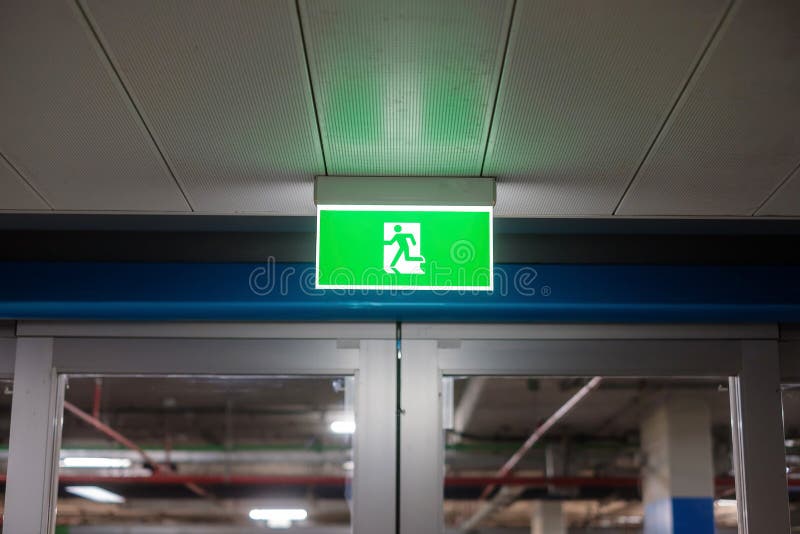 Fire Emergency Exit Sign on the Wall Inside Building at Subway Train ...