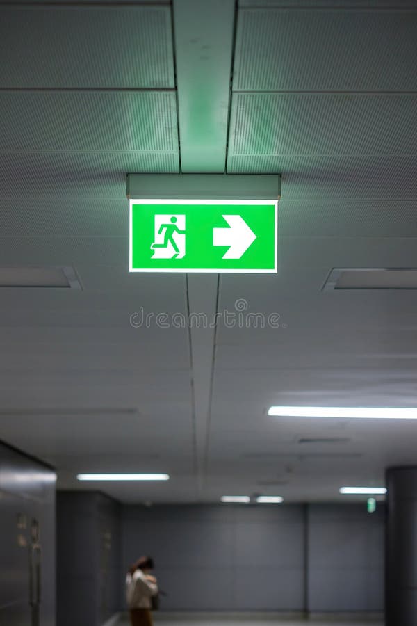 Fire Emergency Exit Sign on the Wall Inside Building at Subway Train ...