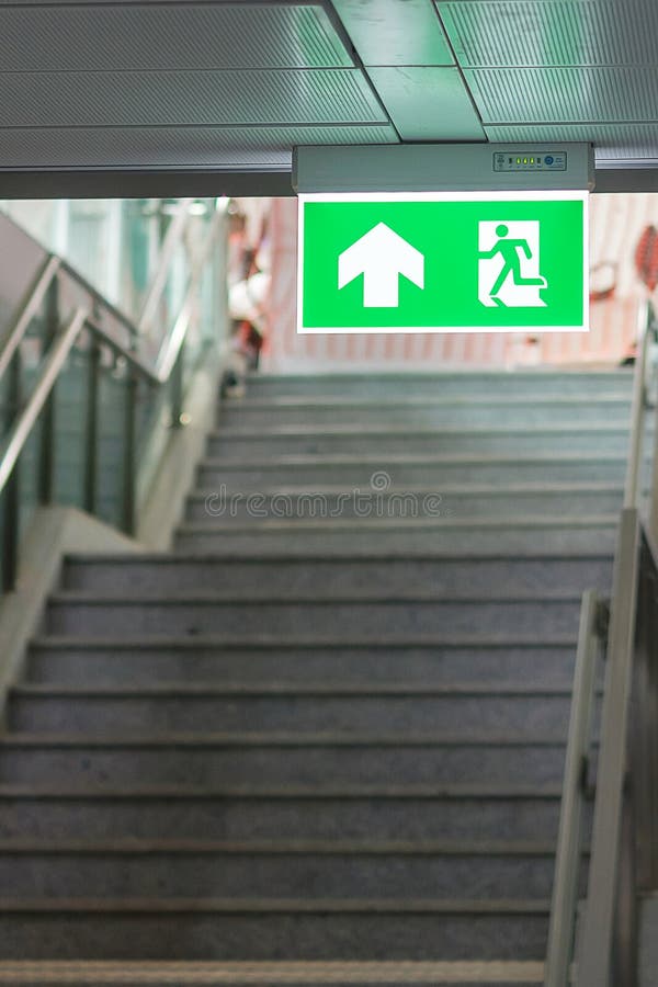 Fire Emergency Exit Sign on the Wall Inside Building at Subway Train ...