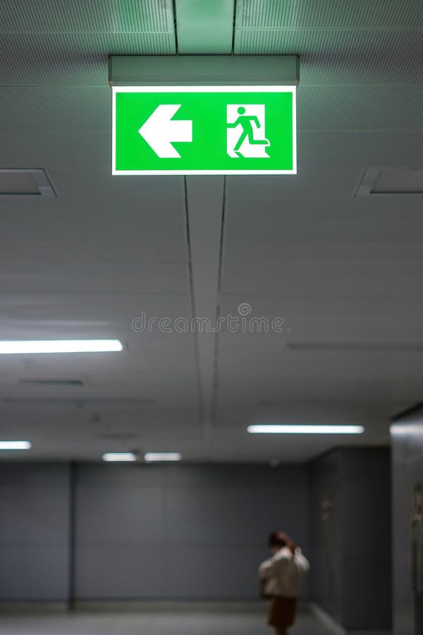 Fire Emergency Exit Sign on the Wall Inside Building at Subway Train ...