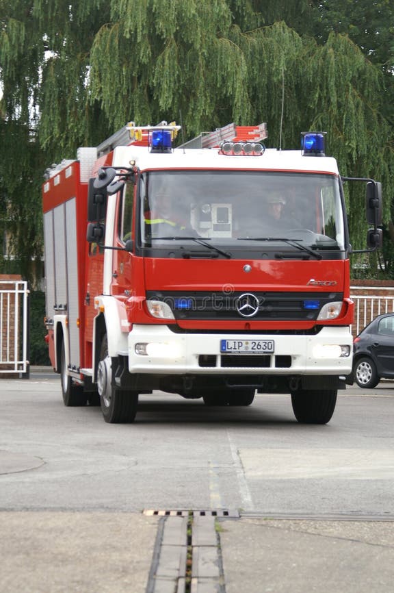 Fire engine on blue light editorial photo. Image of engine - 128910281