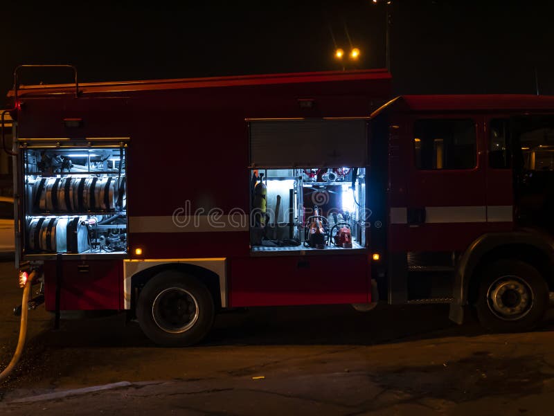 Fire Engine during a Fire Extinguishing at Night Stock Photo - Image of ...