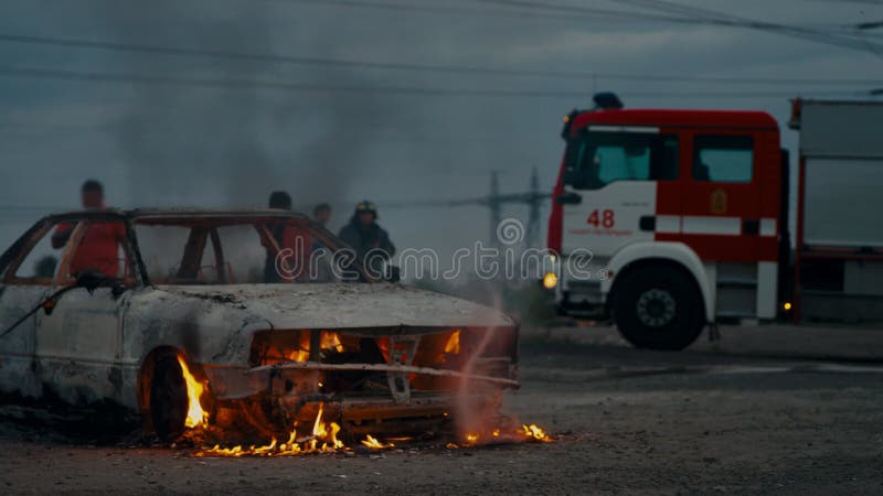 Fire Engine Standing Next To a Completely Burned-out Car. Stock Footage ...