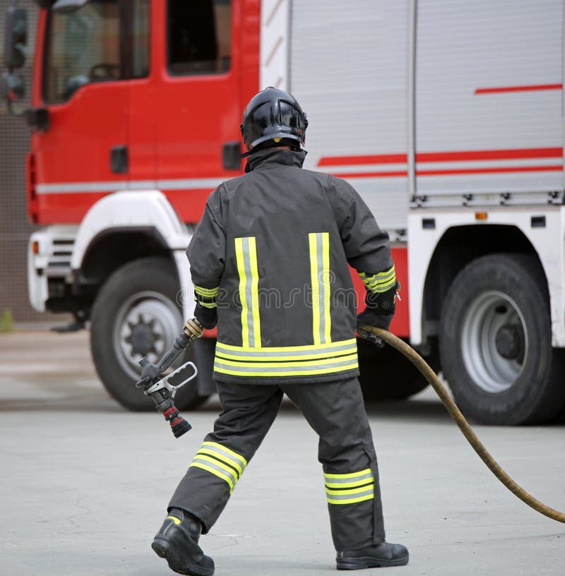Fire Engine and the Fireman Stock Image - Image of firefighting, engine ...