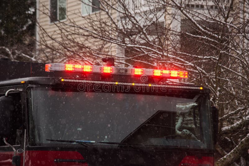 Fire Engine with Flashing Lights on Snowy Day Stock Image - Image of ...