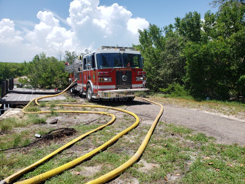 Fire engine with hoses editorial photo. Image of vehicle - 216969376