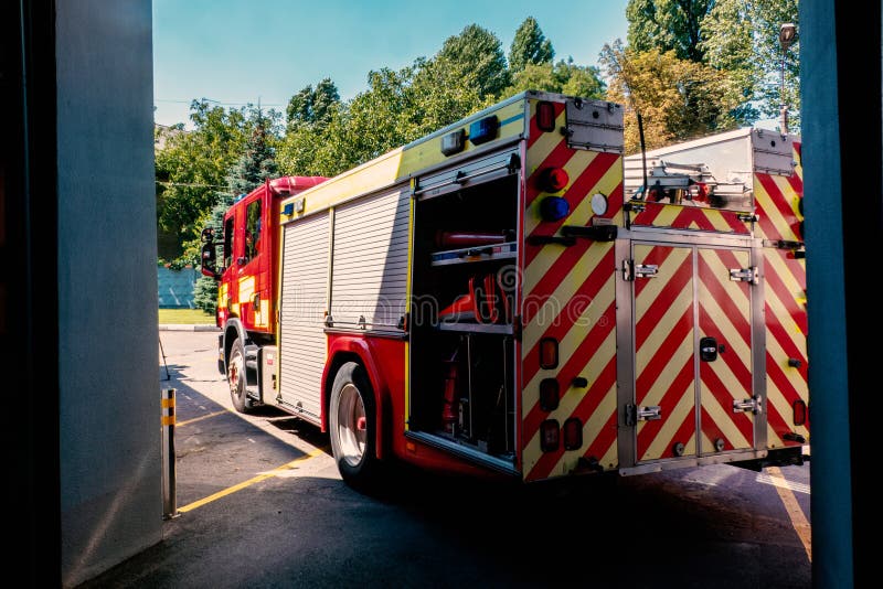 The Fire Engine is Parked Outside the Fire Department Garage Stock ...