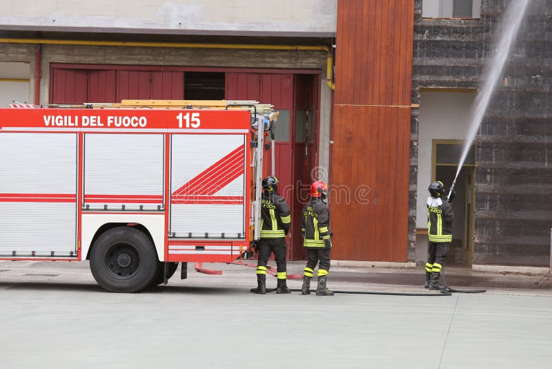 Fire Engine Pulled Up in Front of the Blazing Building Stock Image ...