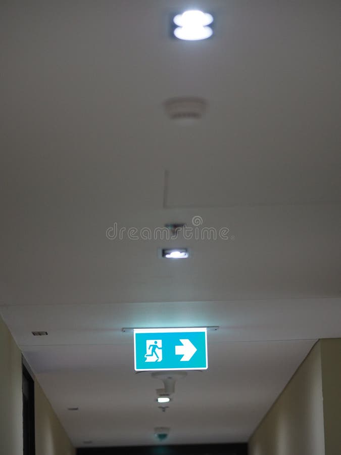 Fire Escape Sign on the Ceiling Fire Exit Arrow Symbol Stock Image ...