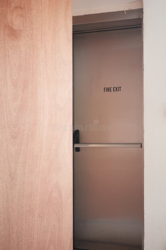 Fire Exit Door Partially Opened in a Modern Building Hallway Stock ...