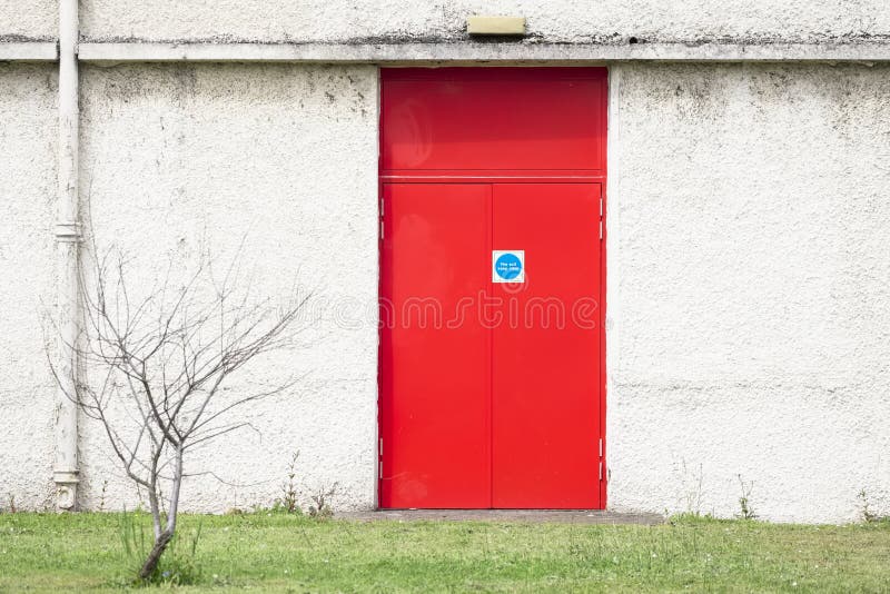 Fire Exit Red Door and White Wall at Work Place Stock Image - Image of ...