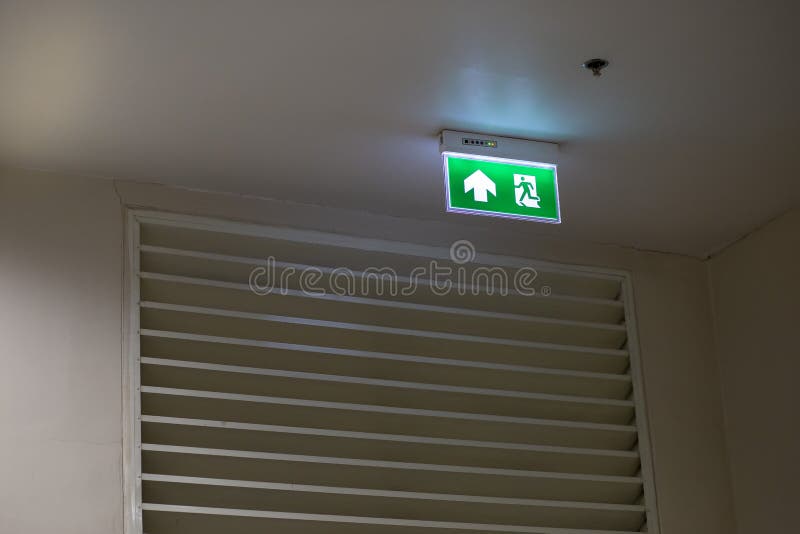 Fire Exit Sign on the Ceiling beside the Exit Door on the Mall Stock ...