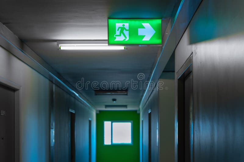 Fire Exit Sign Over Corridor Walkway in Apartment Building Stock Image ...
