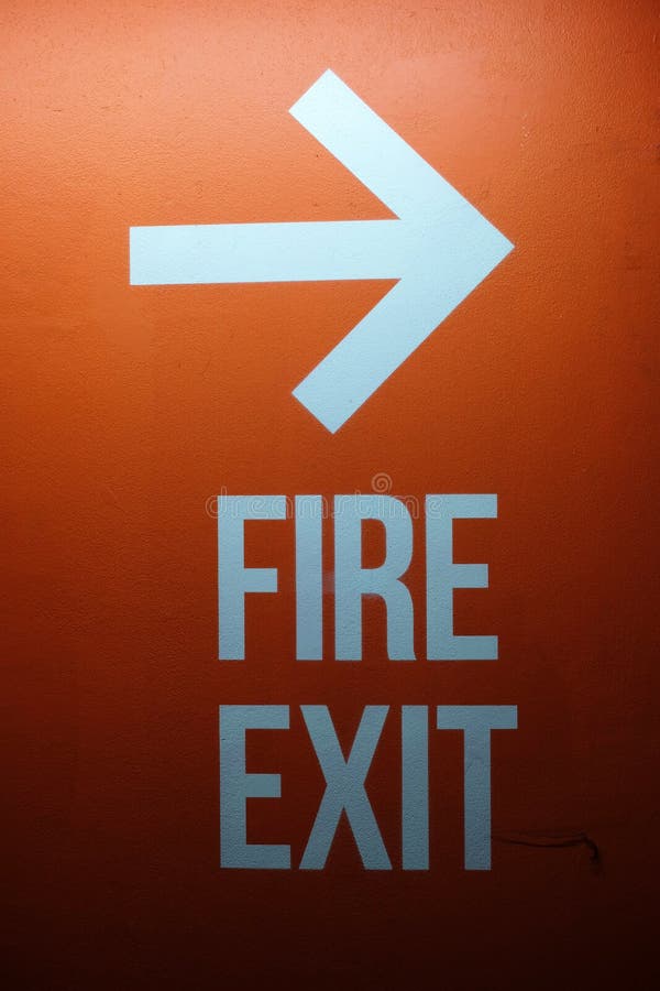 Fire Exit Sign on Red Concrete Wall Background. Stock Image - Image of ...