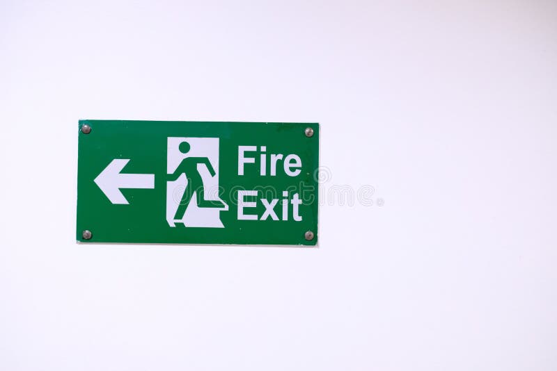 Fire Exit Sign on White Wall, Close Up Stock Image - Image of arrow ...