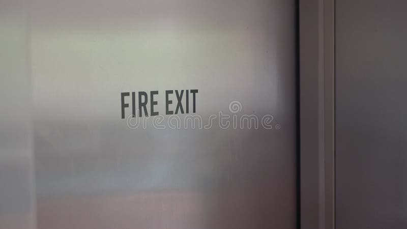 Fire Exit Signage Prominently Displayed in an Urban Environment ...