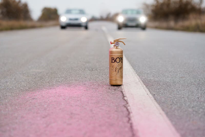 Fire Extinguisher on an Abandoned Road with Approaching Vehicles in the ...