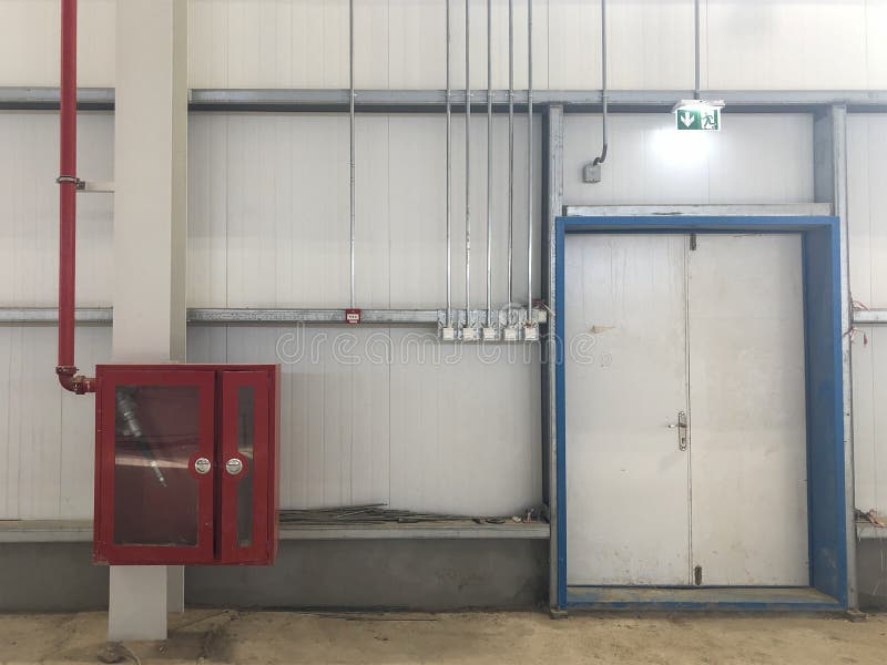 Fire Extinguisher Box with Fire Hose Inside and Emergency Exit Stock ...