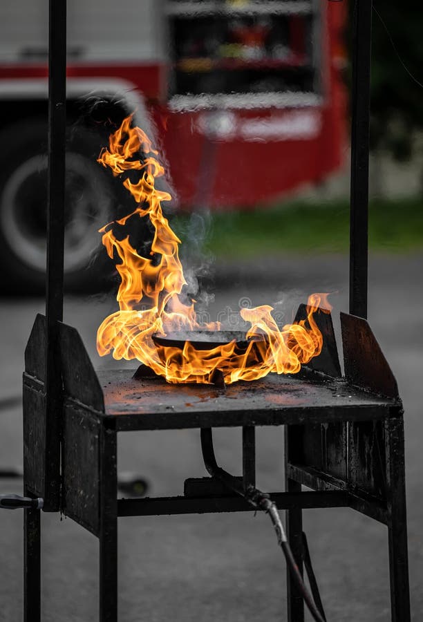 Fire Extinguisher Demonstration with Burning Fire Stock Photo - Image ...