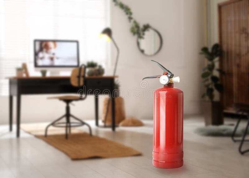 Fire Extinguisher on Floor in Office. Space for Text Stock Photo ...