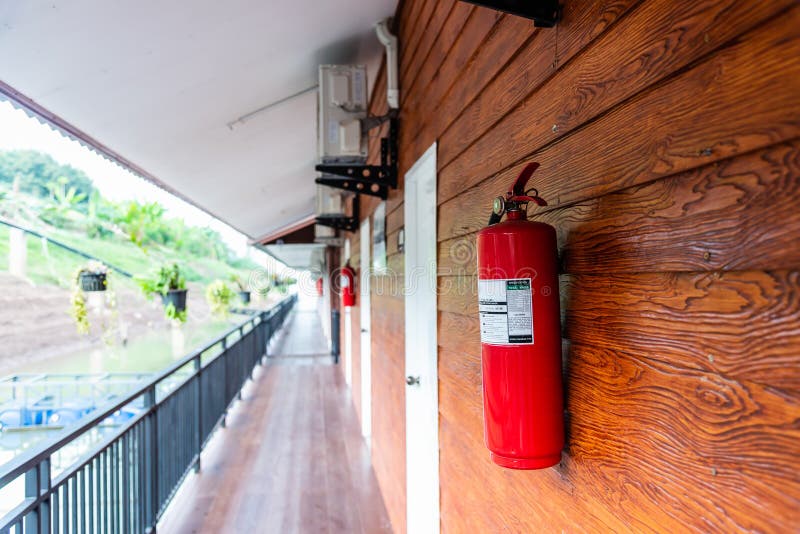 Fire Extinguisher Hanging at Wooden Wall Stock Photo - Image of ...