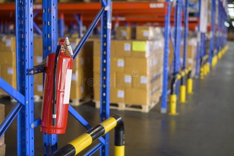 Fire Extinguisher on Shelf of Cardboard Boxes in Modern Warehouse Stock ...