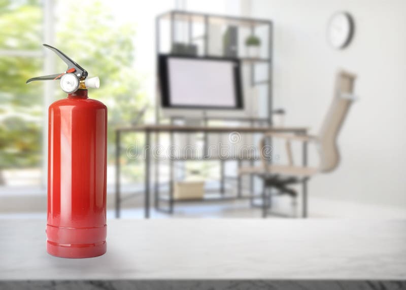 Fire Extinguisher on Stone Table in Office. Space for Text Stock Image ...