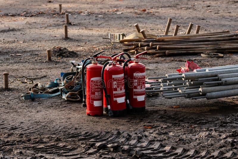 Fire Extinguishers and Construction Materials on a Worksite Stock Image ...