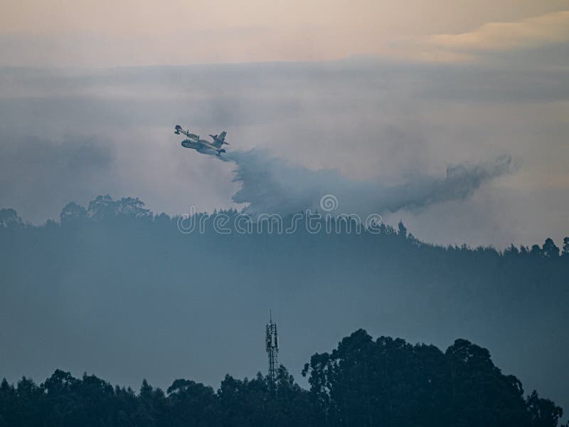Fire Extinguishing Plane Water Bomber Dumping Its Load, Spain Stock ...