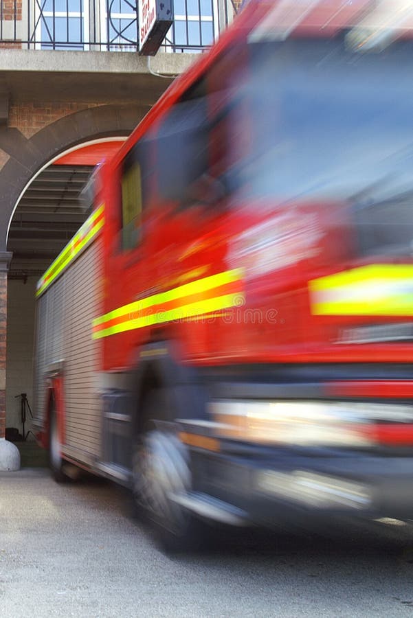 Fire Engine Coming Out of Fire Station Stock Photo - Image of heat ...
