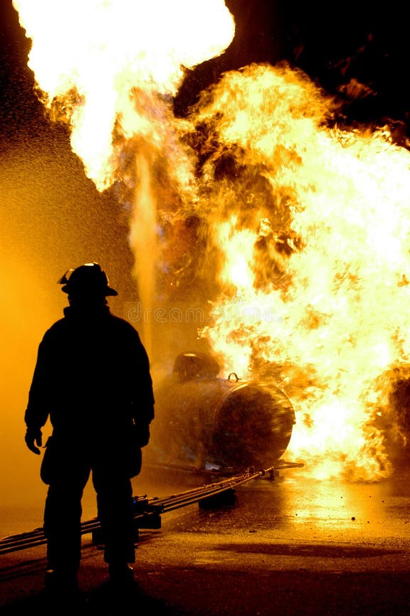 Fire Fighter and Flames stock image. Image of safety, building - 4757659