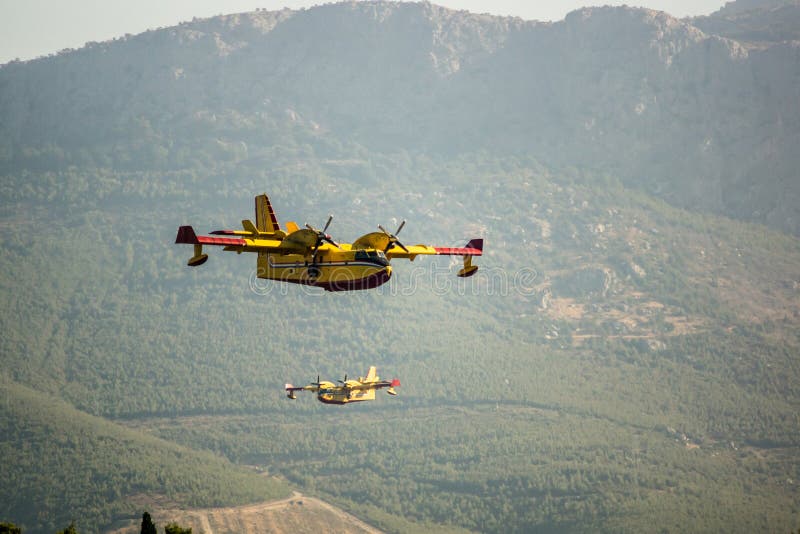 Fire Fighter Plane Over the Mountains Stock Photo - Image of plane ...