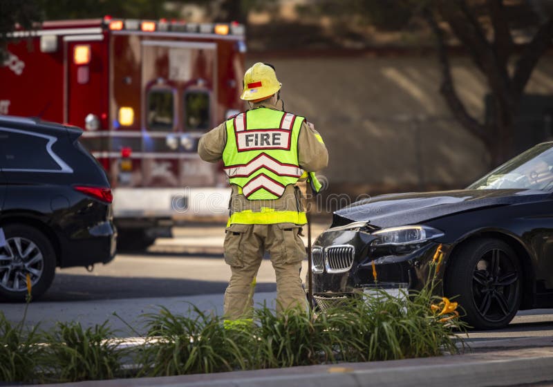 A Fire Fighter Standing at a Car Accident Scene Editorial Photo - Image ...