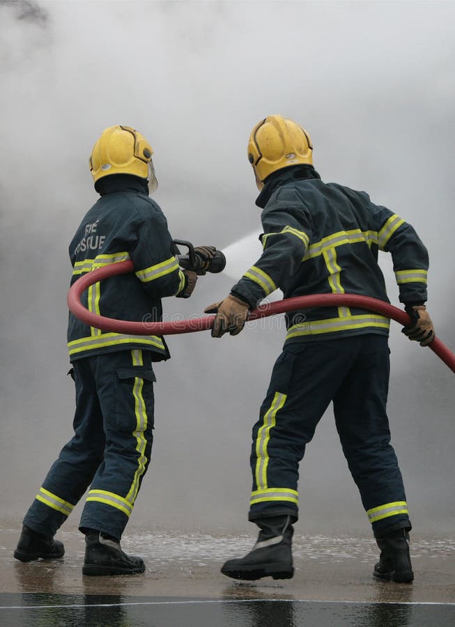 Fire-fighters with hose editorial stock photo. Image of broken - 46796573